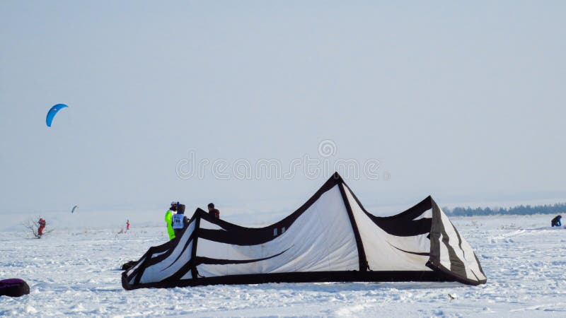 People Kiting in Winter in Snowy Terrain. Snowkiting Stock Image ...