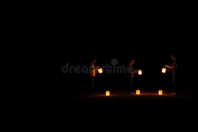 People with Lanterns in Complete Darkness. Space for Text. Stock Image - Image of glow ...