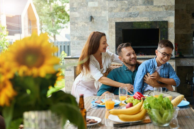 People Laugh Cheerfully at the Dinner Table Stock Photo - Image of ...