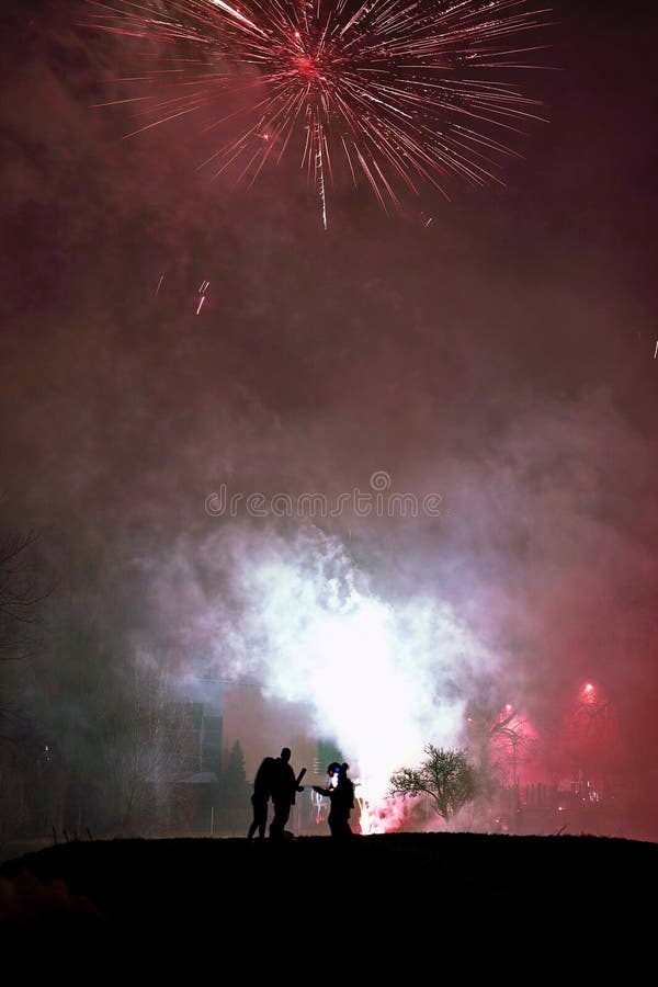 People Launch Fireworks in the Night Sky Stock Photo - Image of festive ...