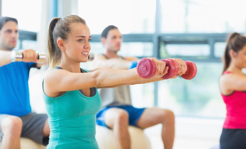 Group of Smiling People Working Out with Dumbbells Stock Photo - Image ...