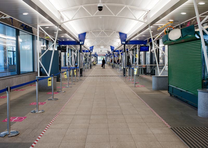 People in Line or Queue at the Empty Bus Station during the Quarantine ...
