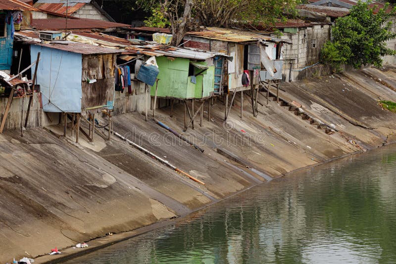 People Living in Poverty Along the Canals of Manila Philippines Stock ...
