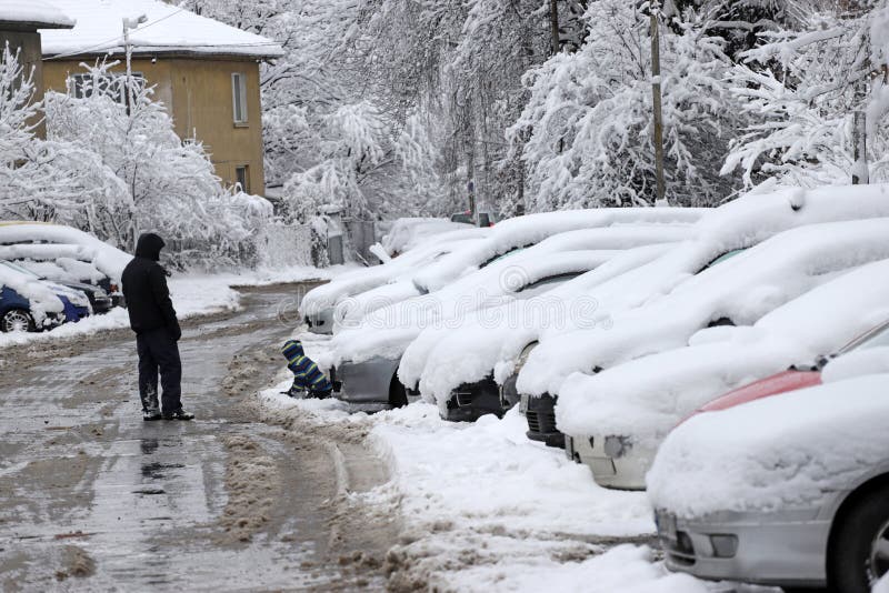 People Look at Covered with Heavy Snow after Snowstorm in Winter Stock ...