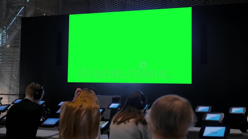 People Looking at Blank Large Interactive Wall Display - Green Screen ...