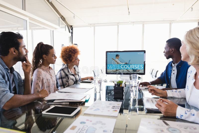 People Looking at a Computer with E-learning Information in the Screen ...