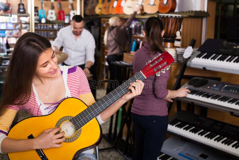 People Looking at Musical Instruments Stock Image - Image of caucasian ...