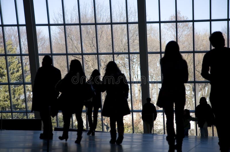People Looking Out Window stock photo. Image of shadows - 19635014