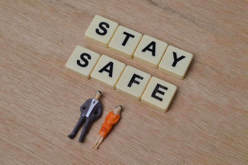 People Miniatures and Square Letters with Text STAY SAFE Stock Image ...