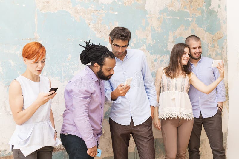 People with mobile phone stock photo. Image of friends - 76338940