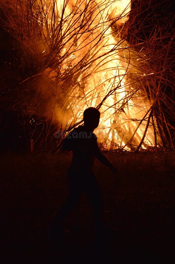 People Next To a Large Fire Lit at Night Stock Photo - Image of ...
