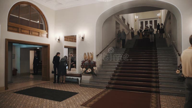 People in Old Classical Concert Hall Interior with Carpet on Staircase ...
