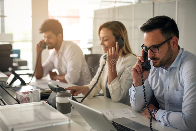 People in Operations Center Talking on Landline Phone. Operator Stock ...