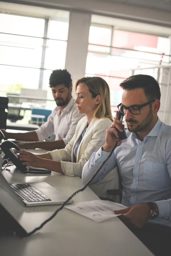 People in Operations Center Talking on Landline Phone. Operator Stock ...