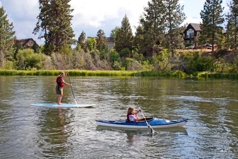 People Paddle Boarding and Canoeing in River Stock Image - Image of ...