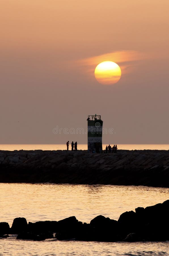 People on the Peer at Sunset Stock Image - Image of group, beach: 105990755