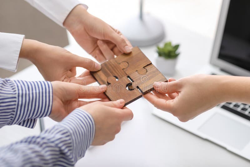 People with Pieces of Jigsaw Puzzle in Office Stock Photo - Image of ...