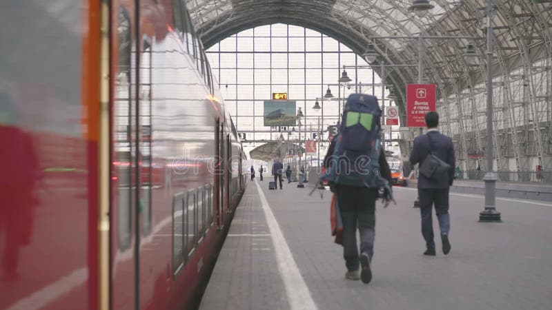 Passengers Walking on the Platform To Catch a Train in the Railway ...