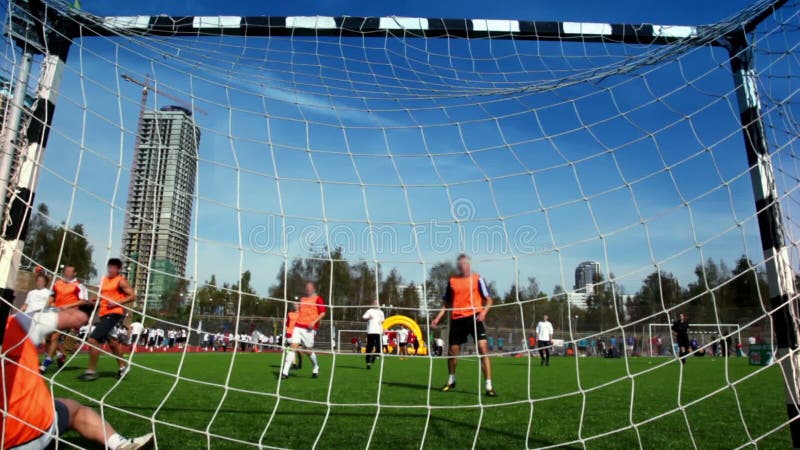 People Play Football at Stadium, View from Behind Stock Video - Video ...