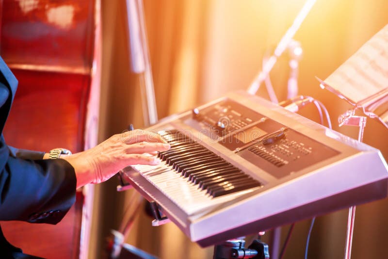 People Play Keyboard Music on Stage. Stock Image - Image of lighting ...