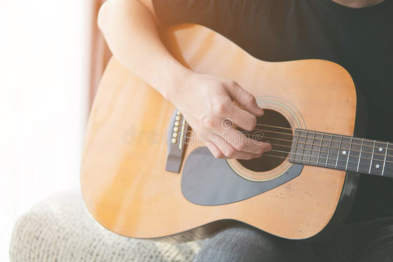 People Playing Acoustic Guitar in the Living Room Stock Image - Image ...