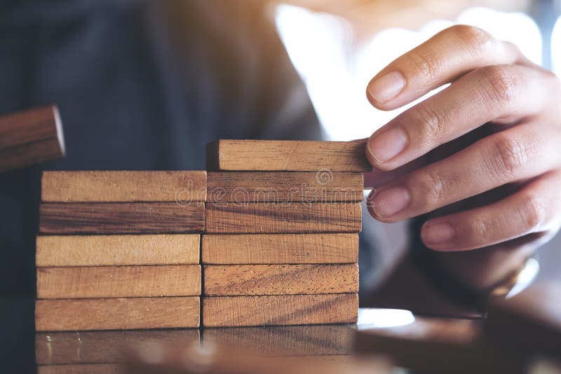People Playing and Building Wooden Puzzle Game Stock Photo - Image of ...