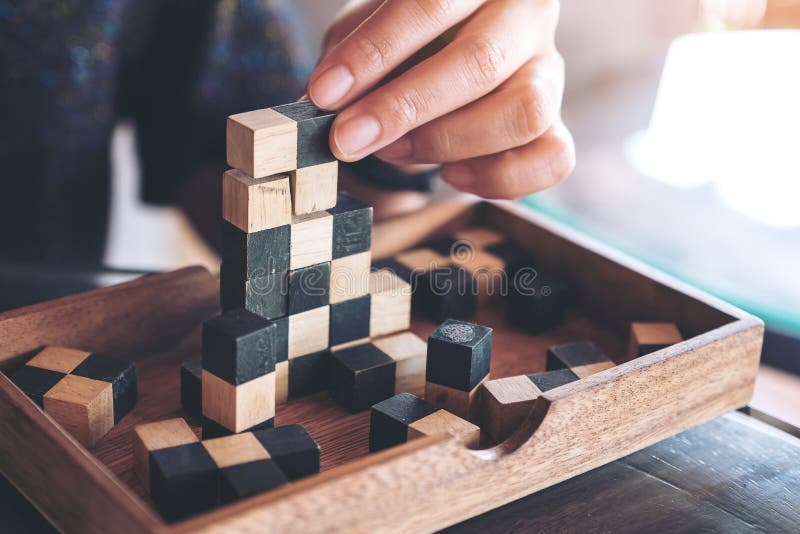 People Playing and Building Wooden Puzzle Game Stock Photo - Image of ...