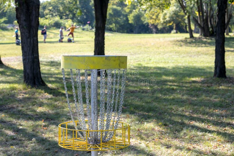 People Playing Flying Disc Golf Sport Game in the Park Stock Image ...