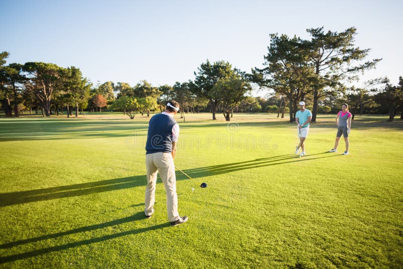 People Playing Golf Together Stock Photo - Image of outdoors, hobbies ...