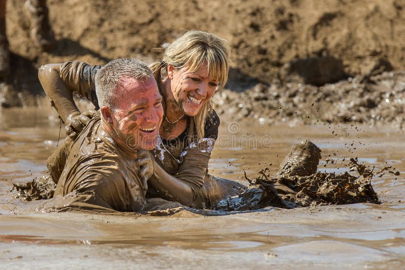 People Playing In The Mud Together Editorial Photography - Image: 27733427