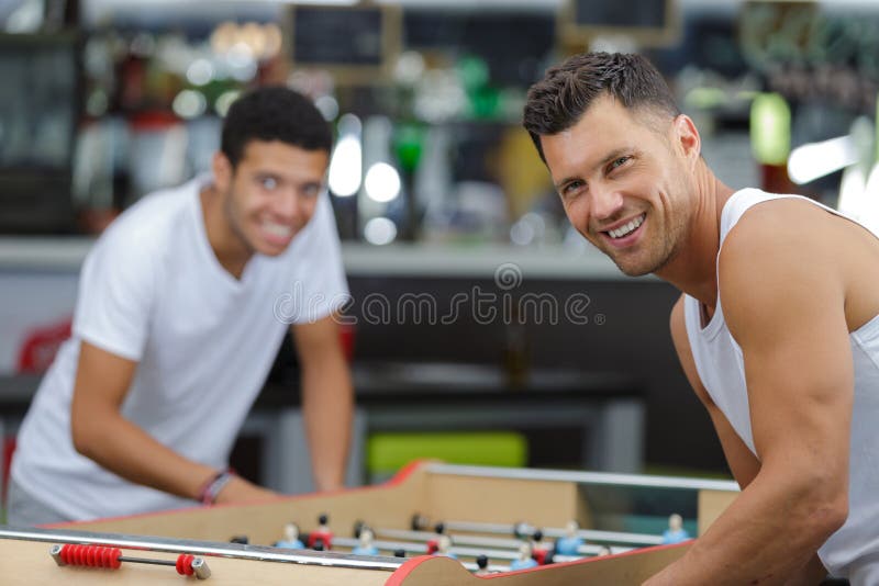 People Playing Table Football Stock Photo - Image of person, side ...