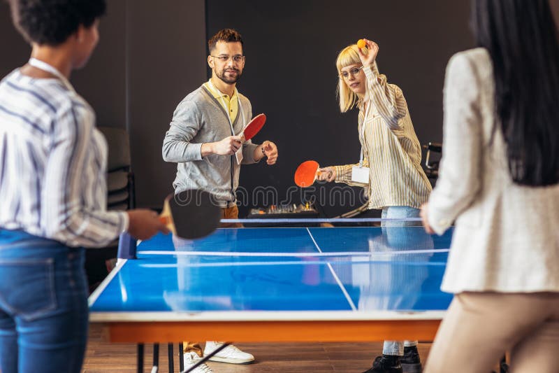People Playing Table Tennis in the Office at Work Stock Photo - Image ...