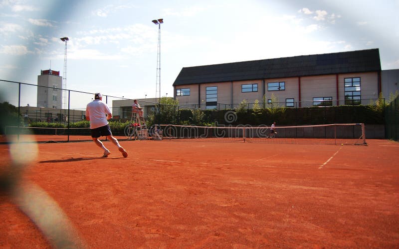 People playing tennis stock image. Image of spectator - 5190873