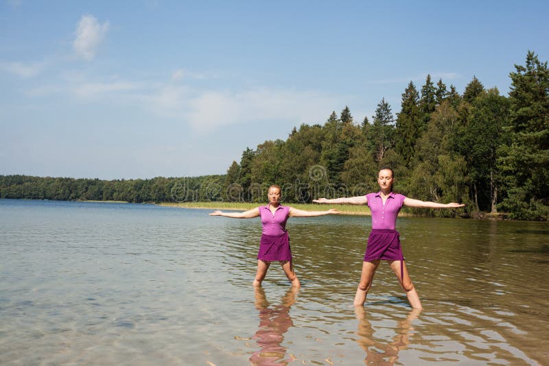People practicing yoga stock photo. Image of practicing - 26176494