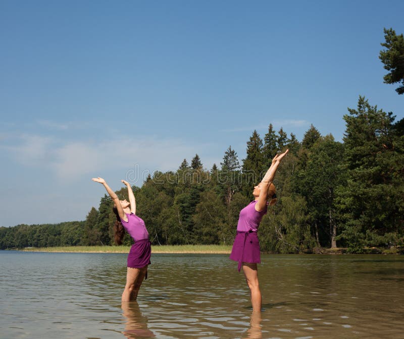 People practicing yoga stock photo. Image of meditating - 26176632