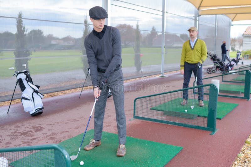 People Practise Golf at City Centre Golf Driving Range Stock Photo ...