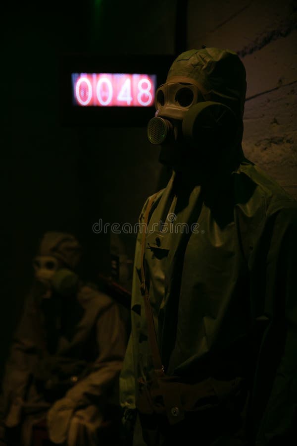People in Protective Suits Against Radiation after a Nuclear Explosion ...