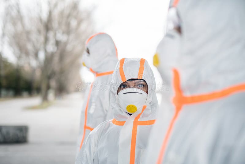People with Protective Suits and Respirators Outdoors, Coronavirus ...