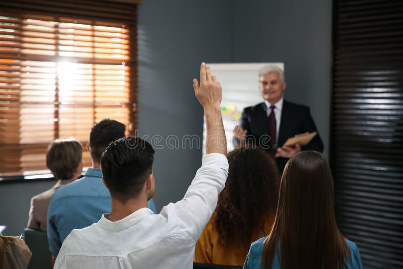Adult Education Class Raising Hands To Ask Questions Stock Photos ...
