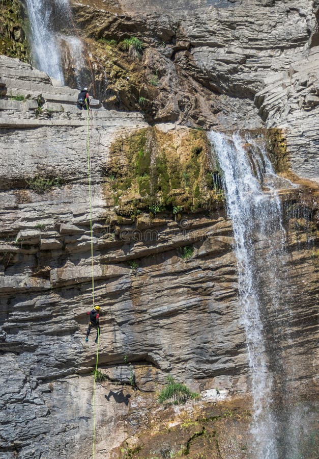People Rappelling in an Impressive Waterfall Stock Photo - Image of ...