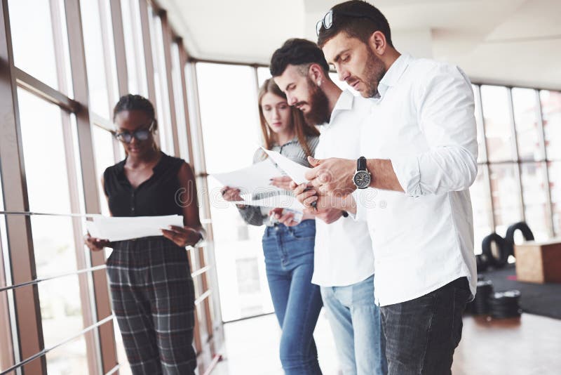 People Reading Documents in the Office with Big Windows Stock Image ...