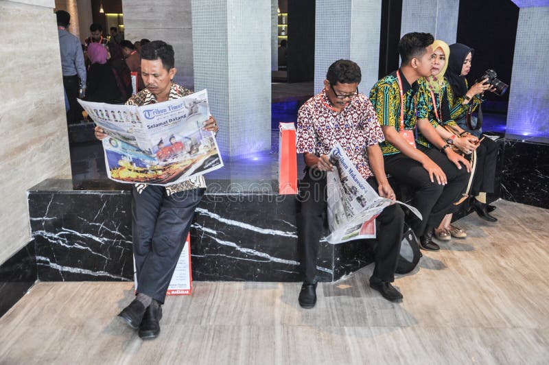 People Reading Newspaper editorial image. Image of convention - 70706025
