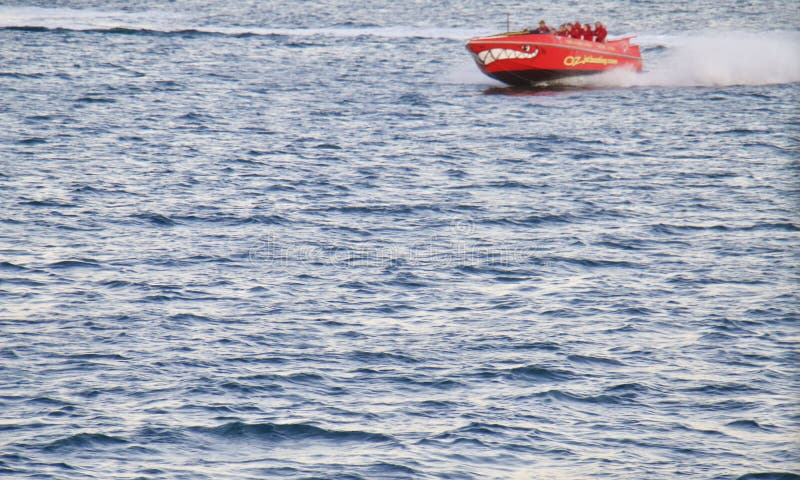 People on a red jet ski stock photo. Image of recreation - 320353128