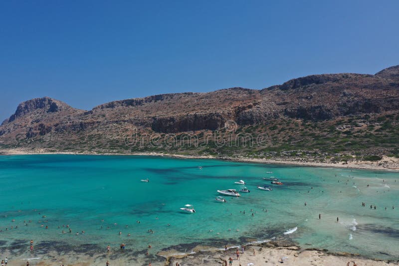 People Relaxing and Doing Navigation on a Sandy Beach in Balos, Crete ...