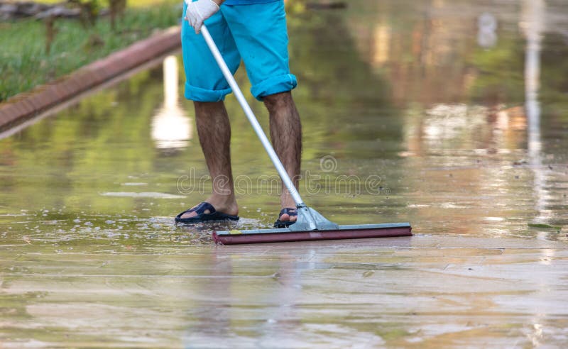 People Remove Water from the Street Stock Photo - Image of outdoor ...
