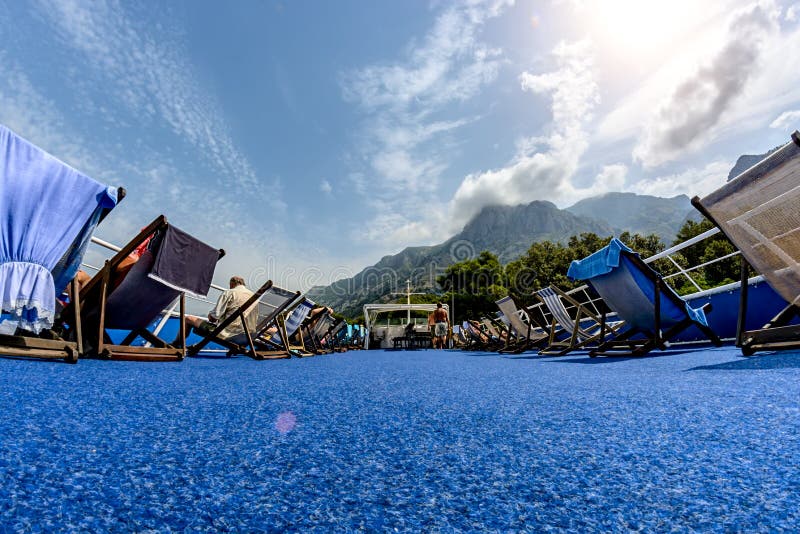People Rest Lying in Armchairs on the Ship`s Deck Stock Photo - Image ...