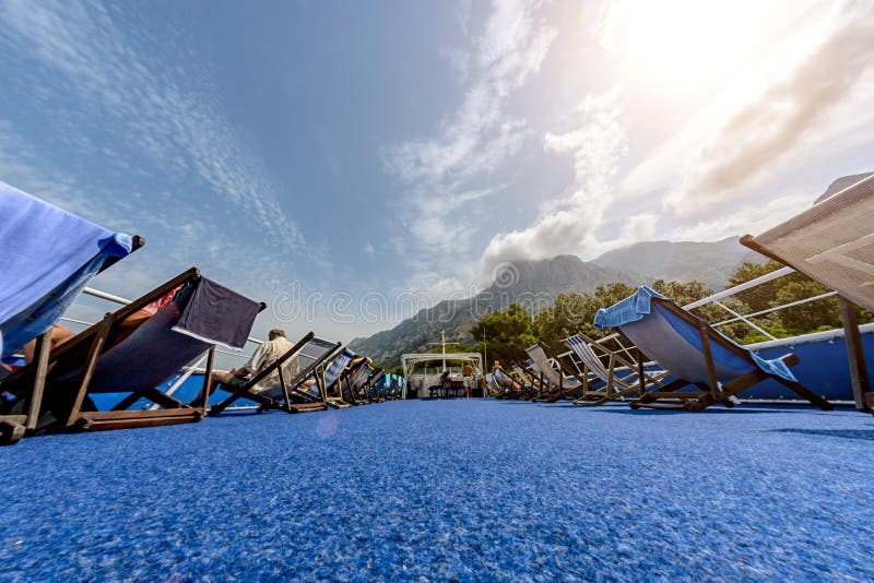 People Rest Lying in Armchairs on the Ship`s Deck Stock Image - Image ...