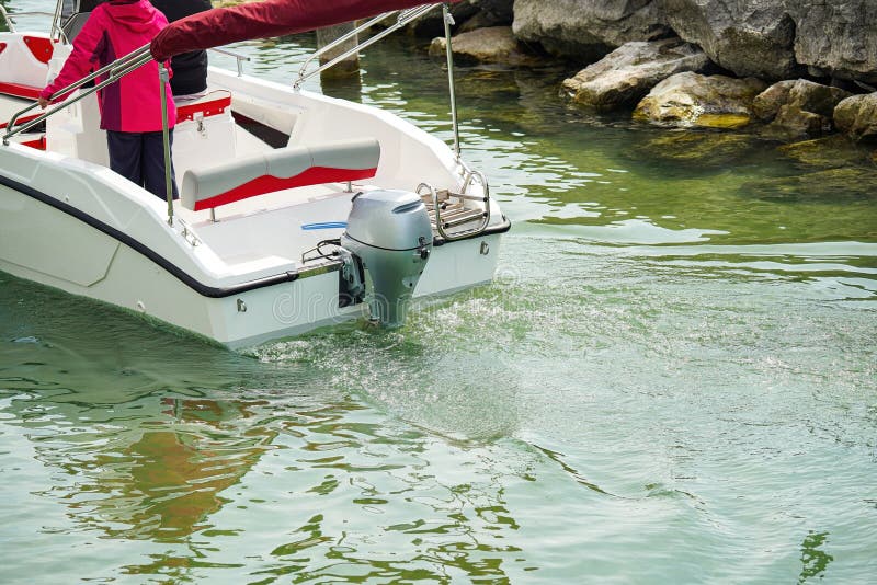 People Ride on a Pleasure Boat. the Back of the Boat with the Motor ...
