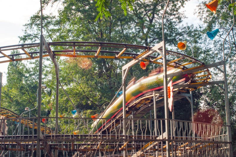People Ride on a Roller Coaster in an Amusement Park Stock Photo ...
