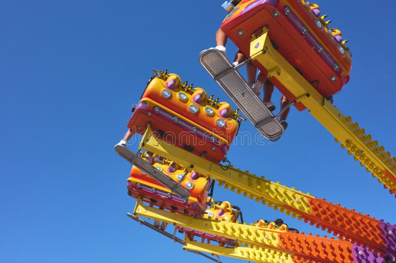 People Riding on a Carousel in an Amusement Park Stock Photo - Image of ...